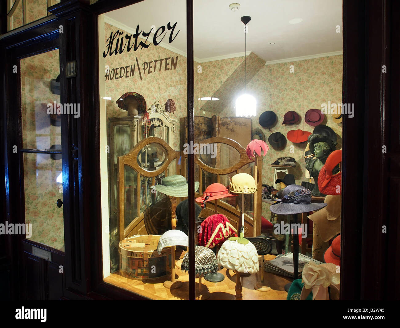 This photograph shows a hat shop display inside the Louwman Museum in ...