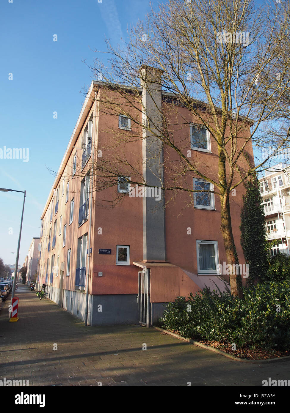 This photograph captures a street corner at the intersection of ...