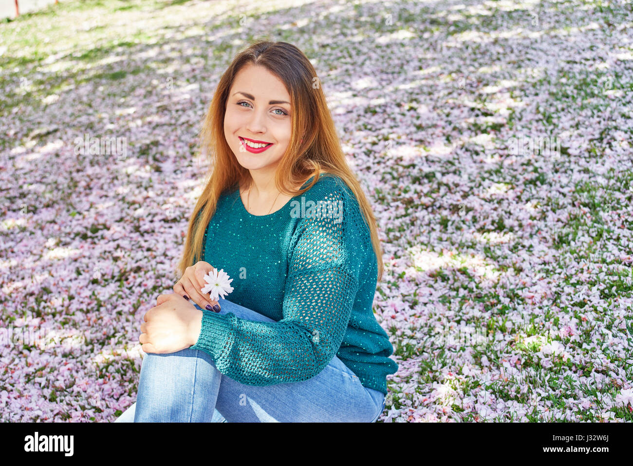 A woman in a spring park Stock Photo - Alamy