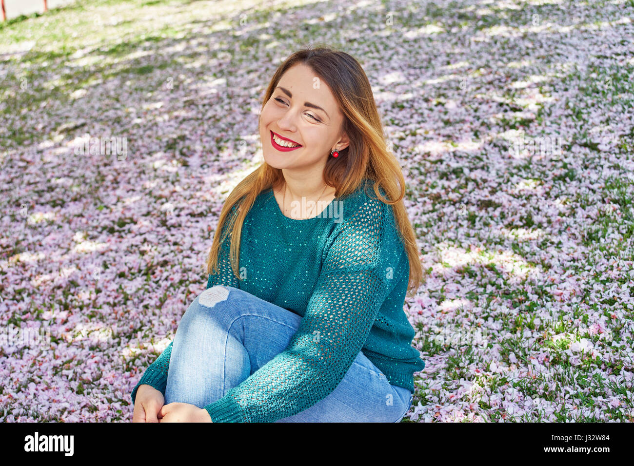 A woman in a spring park Stock Photo - Alamy