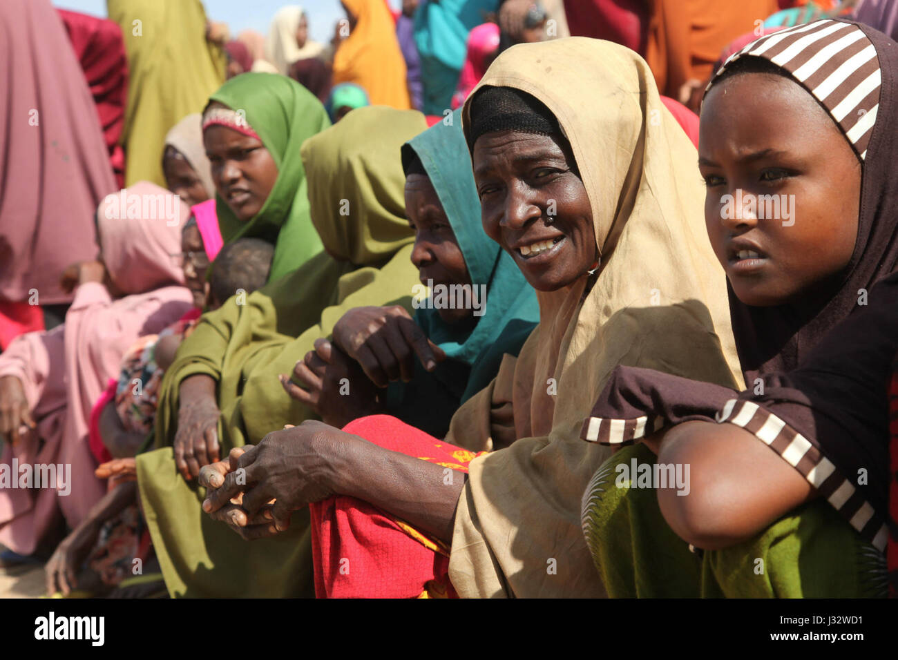 Residents of Goobweyn, in the Lower Jubba region of Somalia, wait for ...