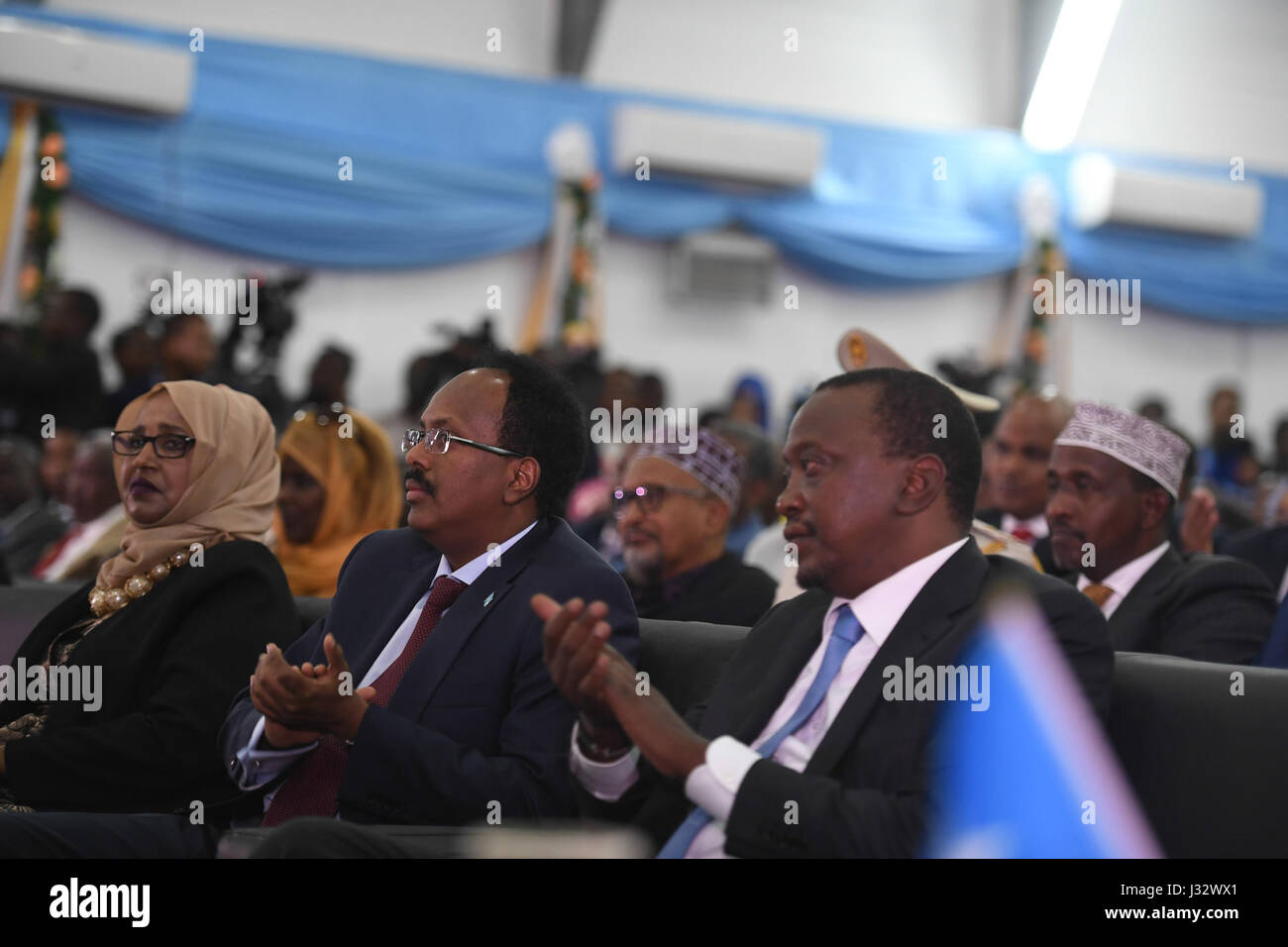 The President of Kenya, Uhuru Kenyatta (right), the President of ...