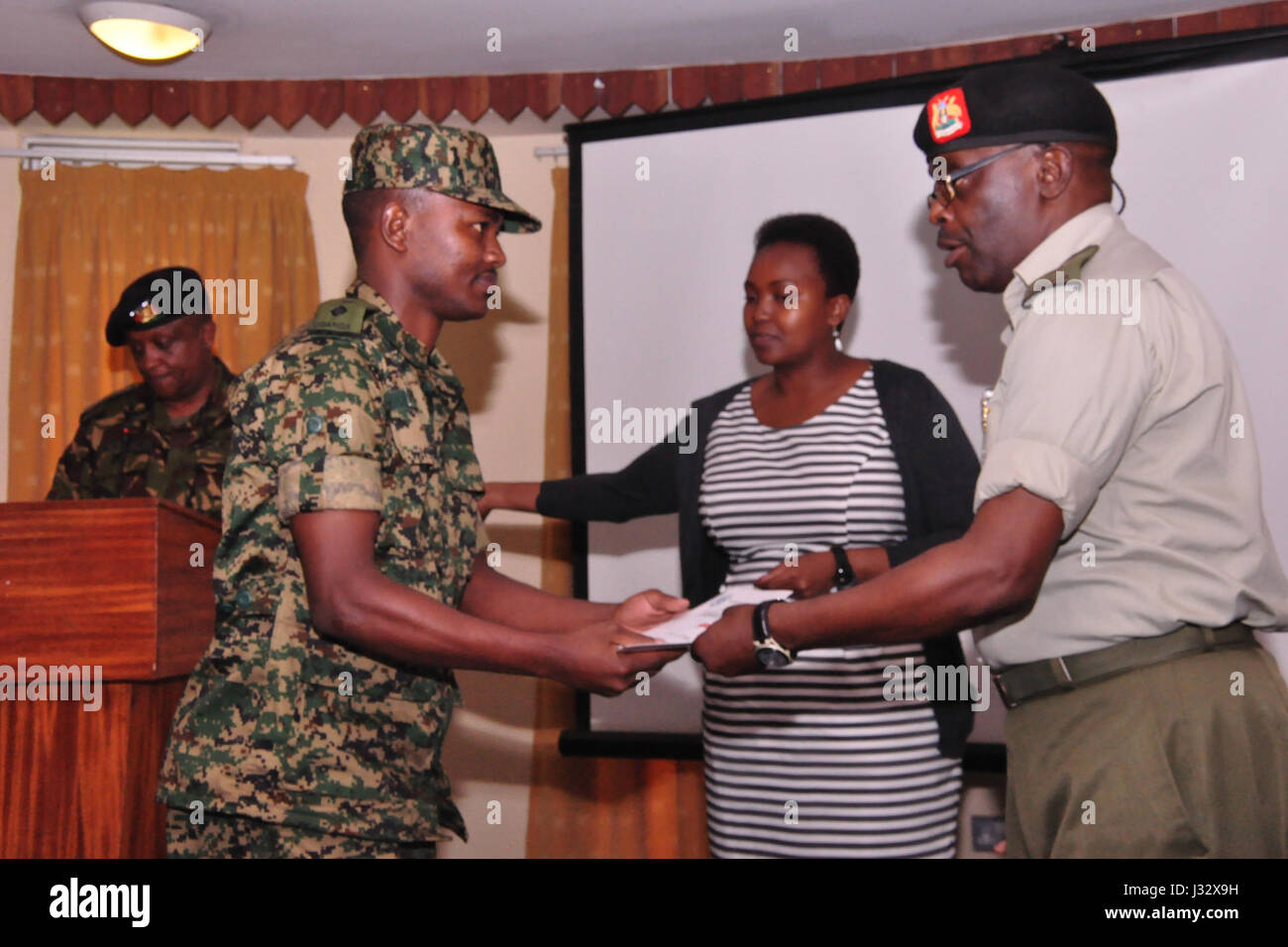 Lt. PK Bbala receives a certificate at the AU-UN Mandatory Media and ...