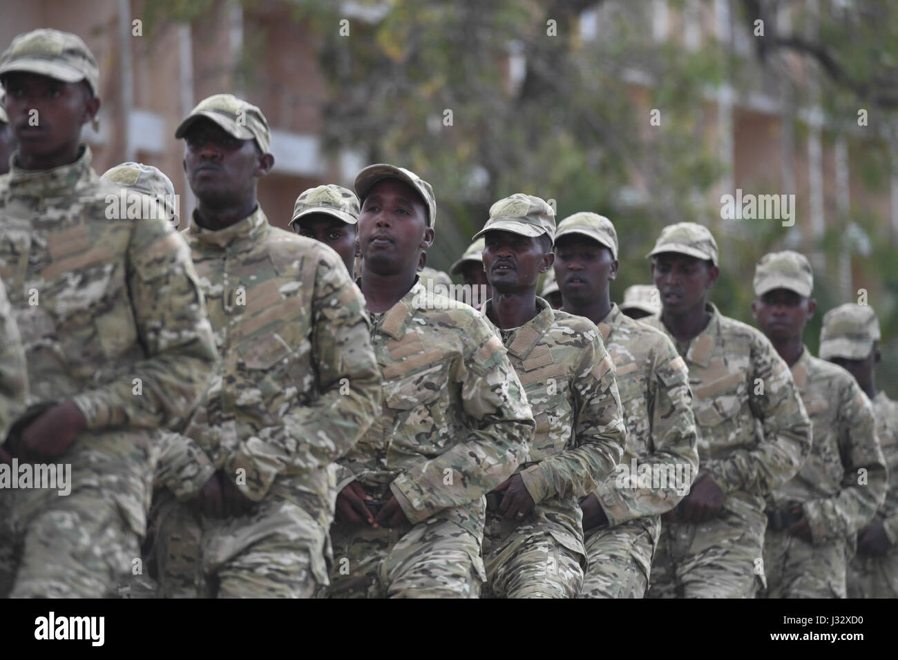 This image shows Somali National Army soldiers marching during the 57th ...