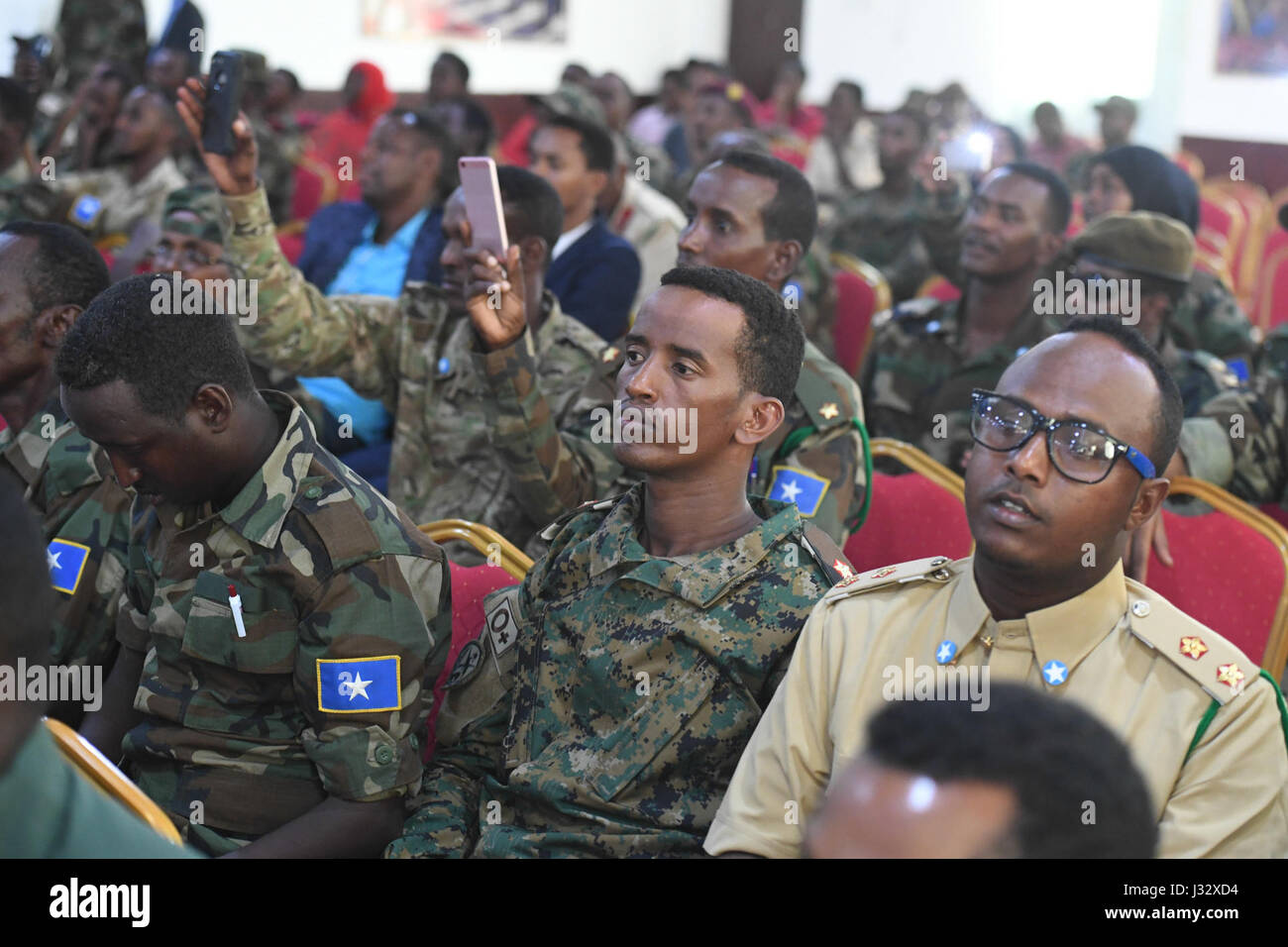 The image shows Somali soldiers at a ceremony commemorating the 57th ...