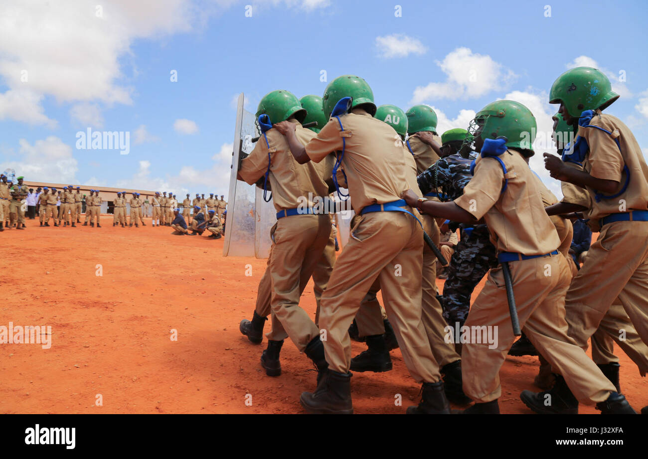 Somali Police Force recruits display crowd control techniques during ...
