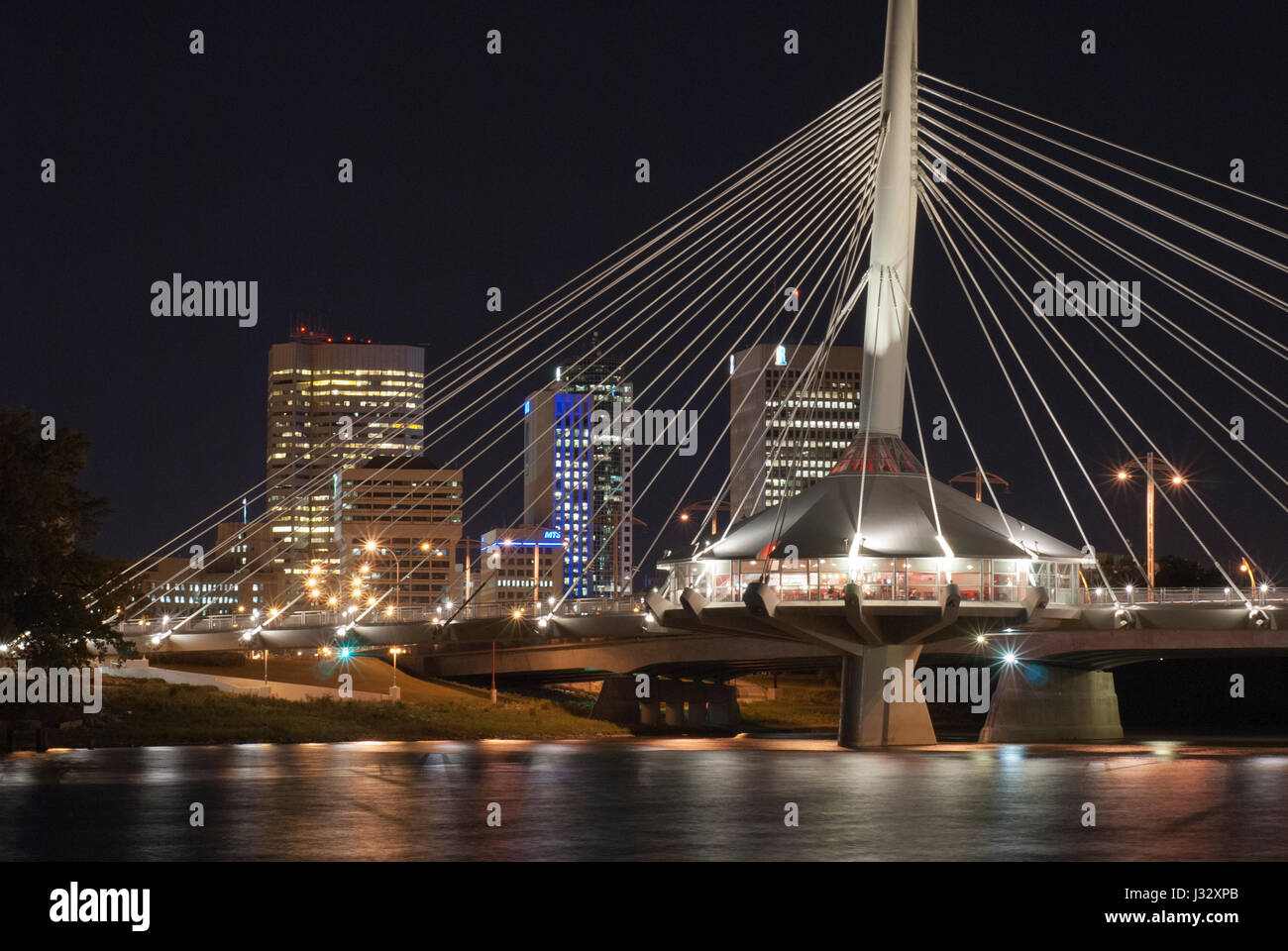 Esplanade Riel Pedestrian Bridge crossing the Red River and skyscrapers ...