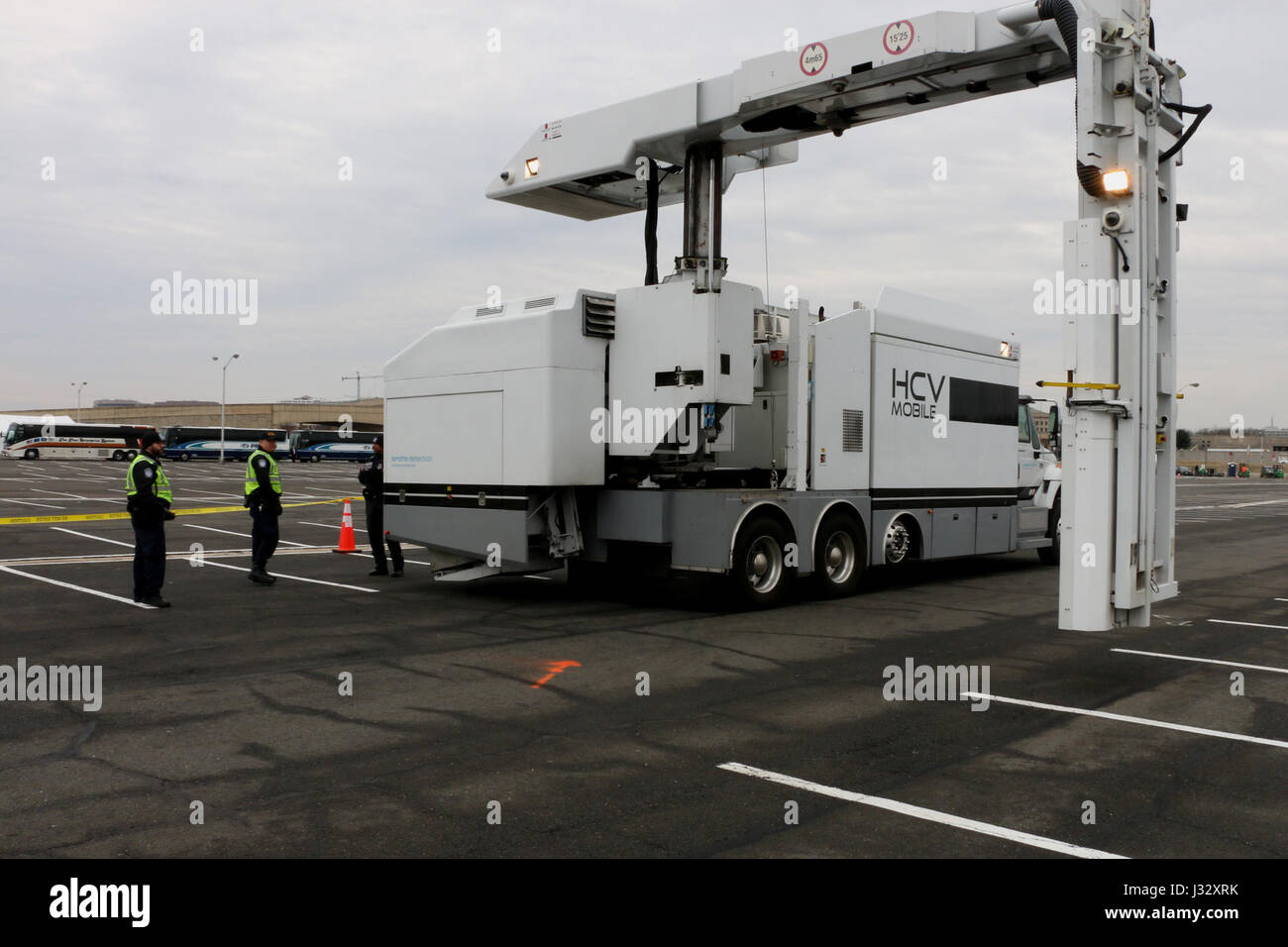U.S. Customs and Border Protection officers conduct vehicle security ...