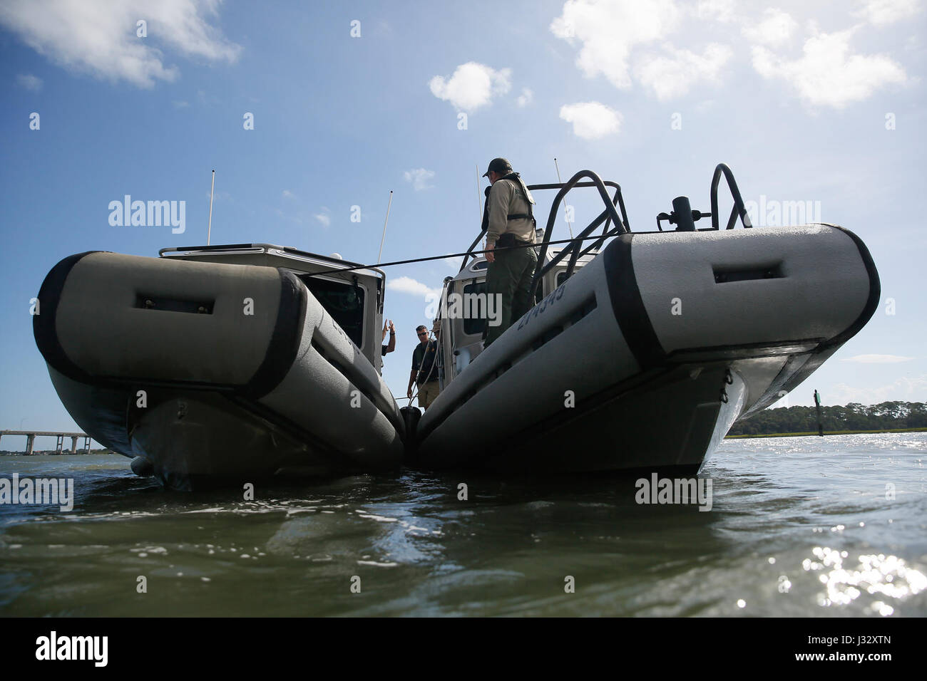 A photograph showing U.S. Border Protection agents undergoing boat ...