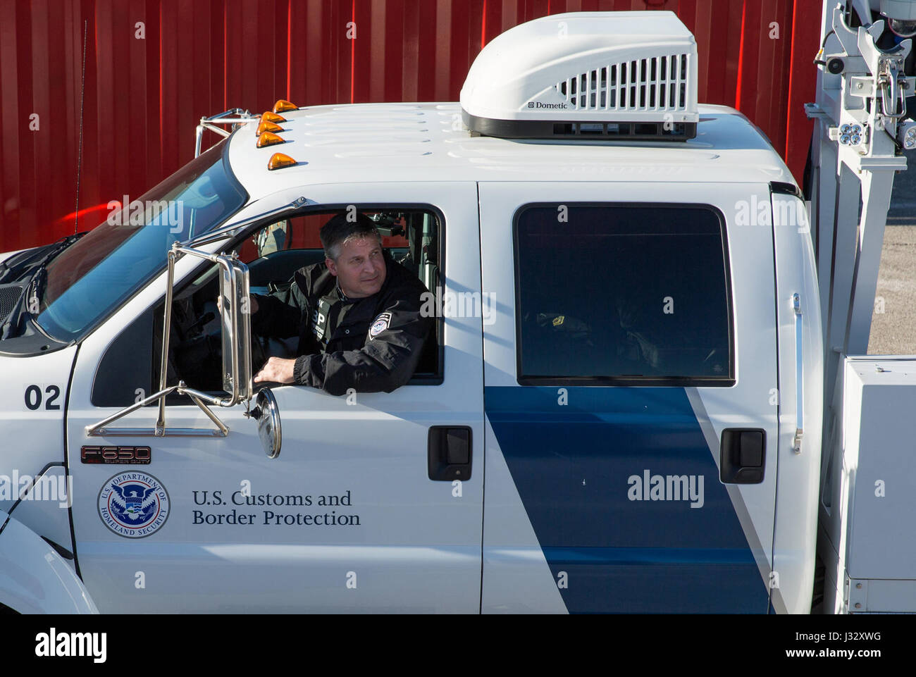 U.S. Customs and Border Protection officers inspect commercial trucks ...