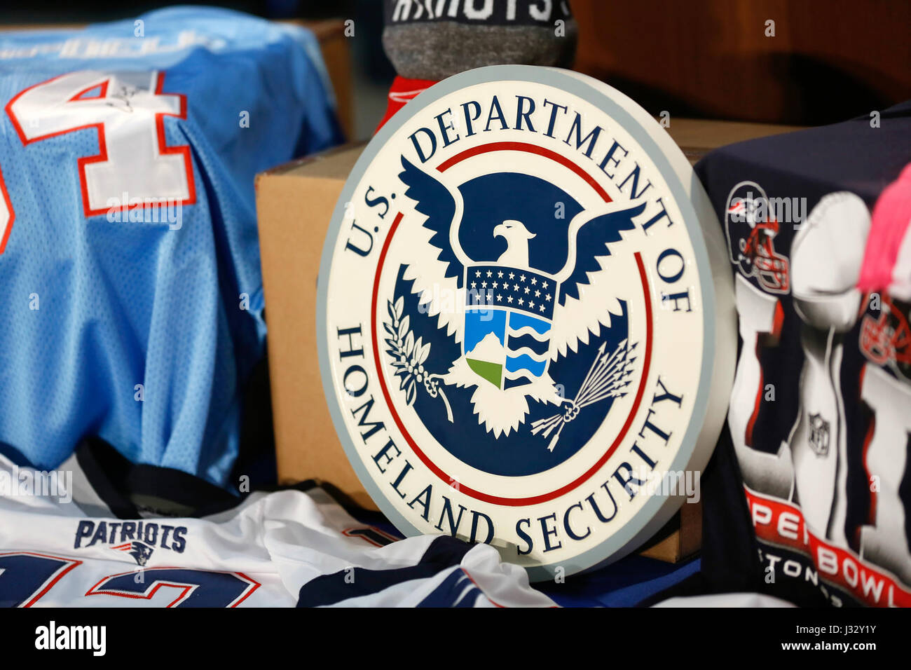 The Department of Homeland Security seal sits among counterfeit ...