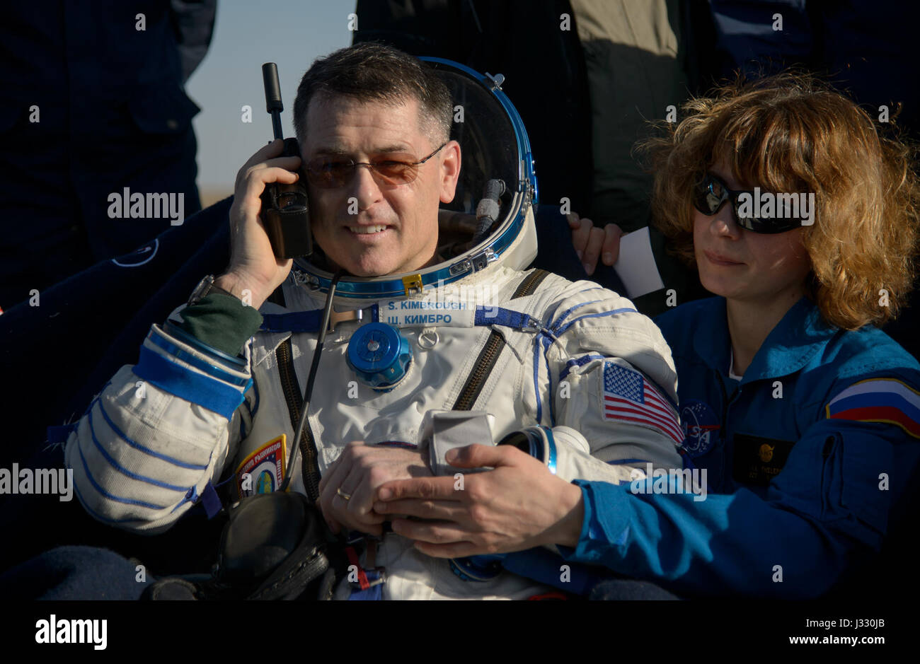 NASA astronaut Shane Kimbrough sits outside the Soyuz MS-02 spacecraft ...