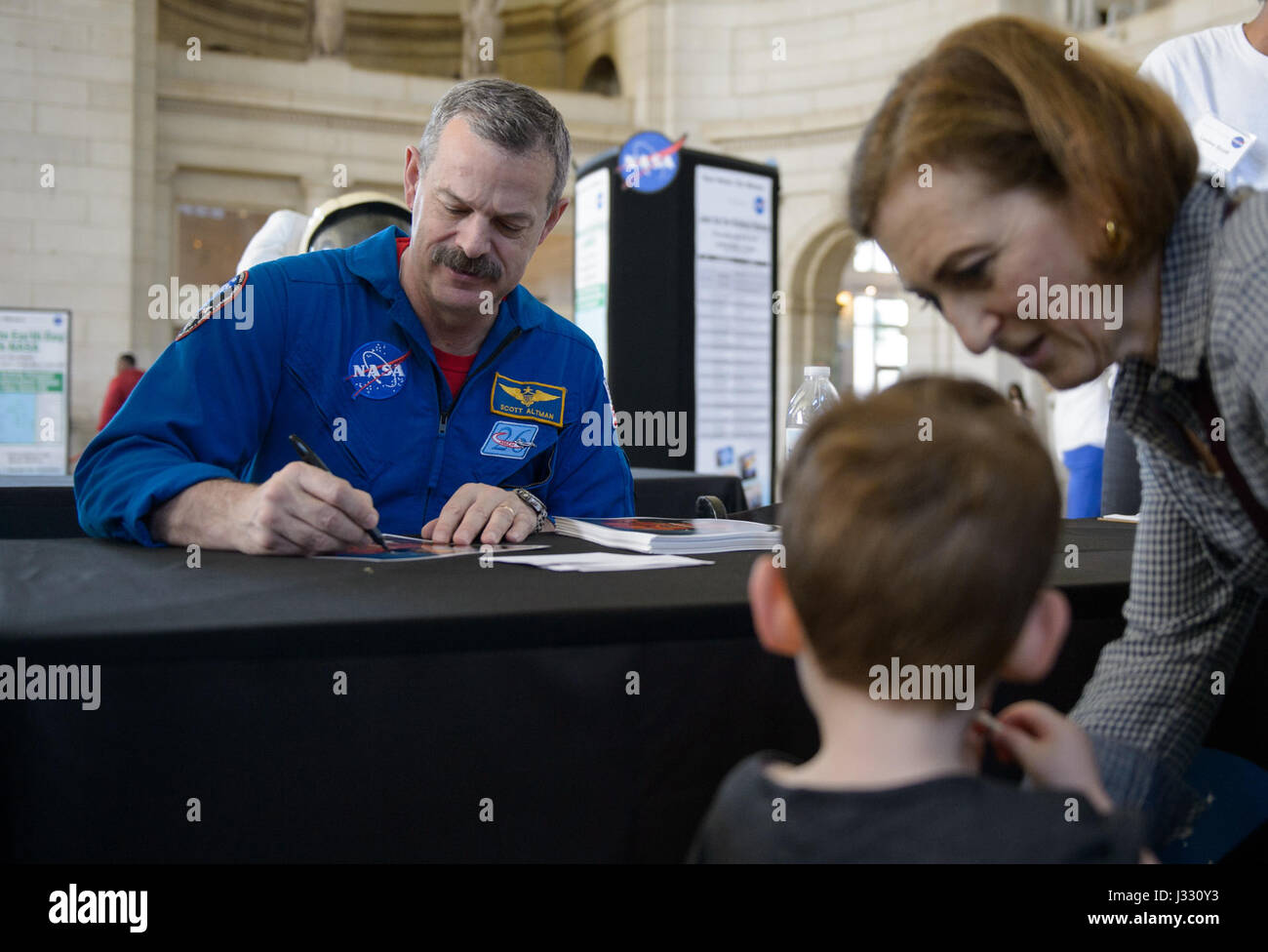 Former NASA astronaut Scott Altman signs autographs for visitors to ...