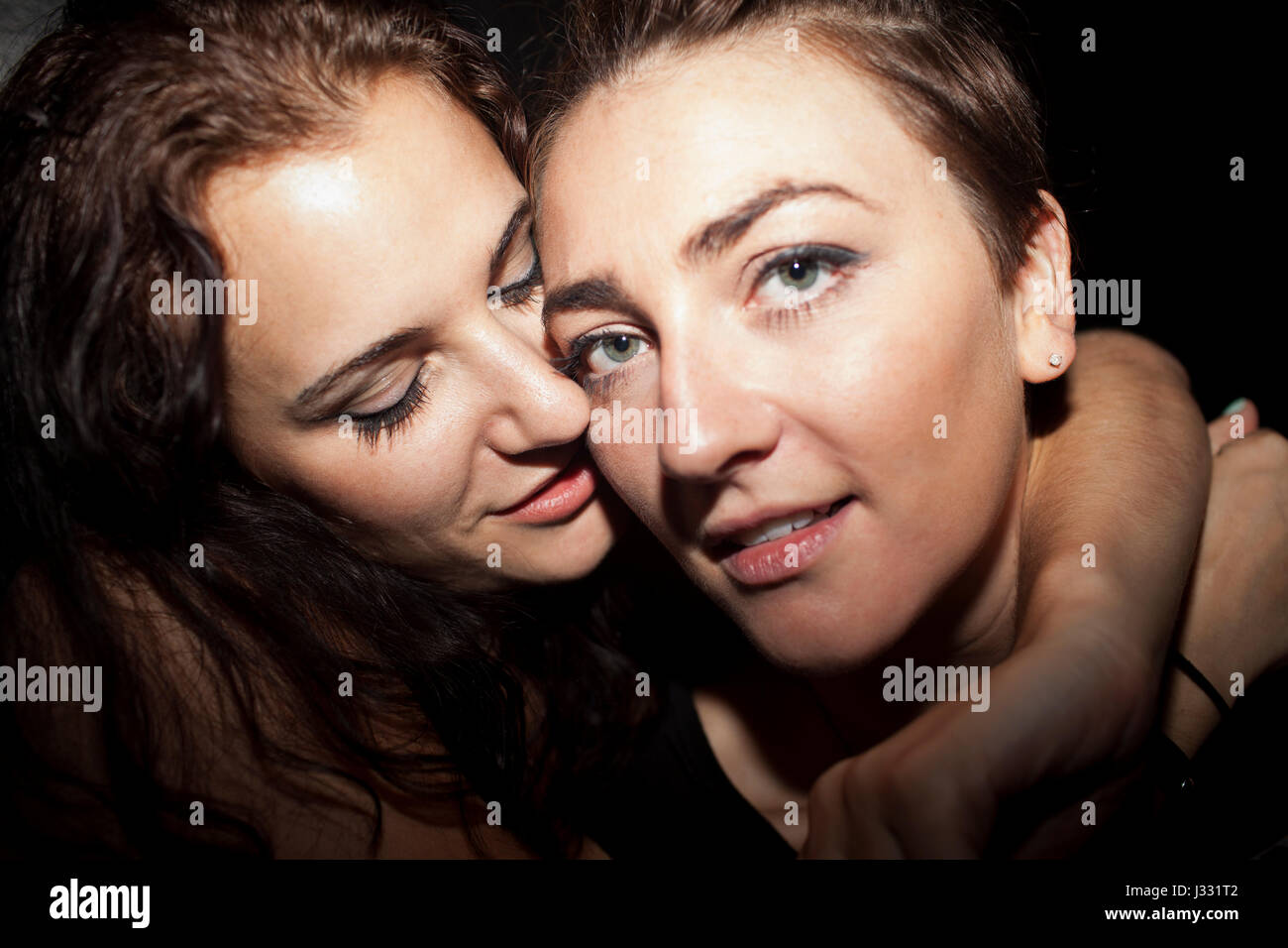 Friends hanging out at a night club Stock Photo - Alamy