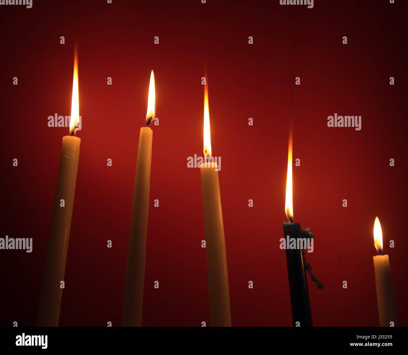 Holy religious candles burning creating a mysterious atmosphere Stock ...