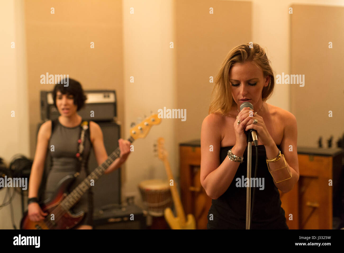Young musicians practicing at a rehearsal space Stock Photo - Alamy