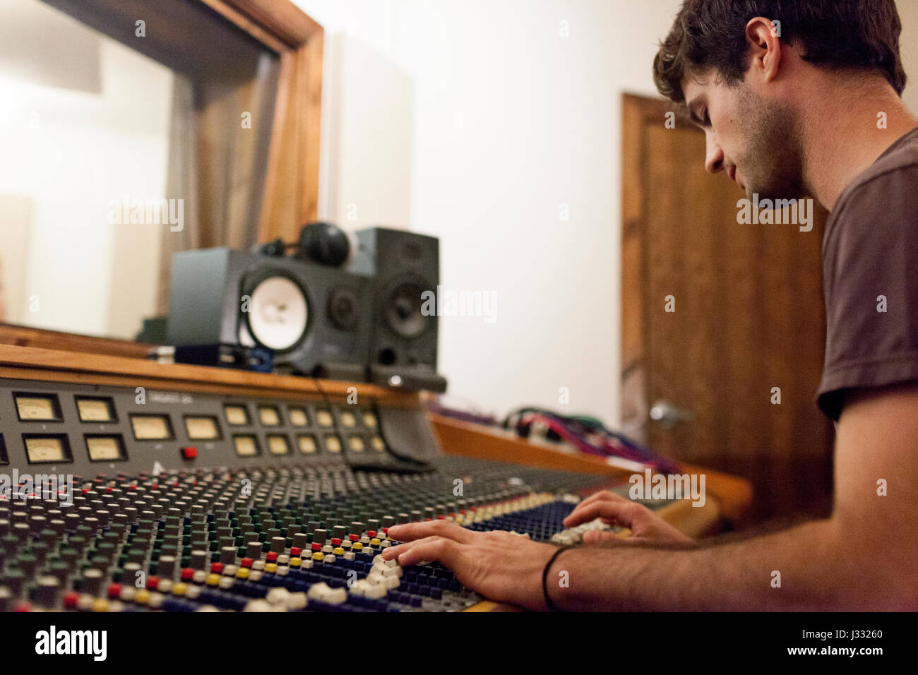Audio engineer working at an instrument panel Stock Photo - Alamy