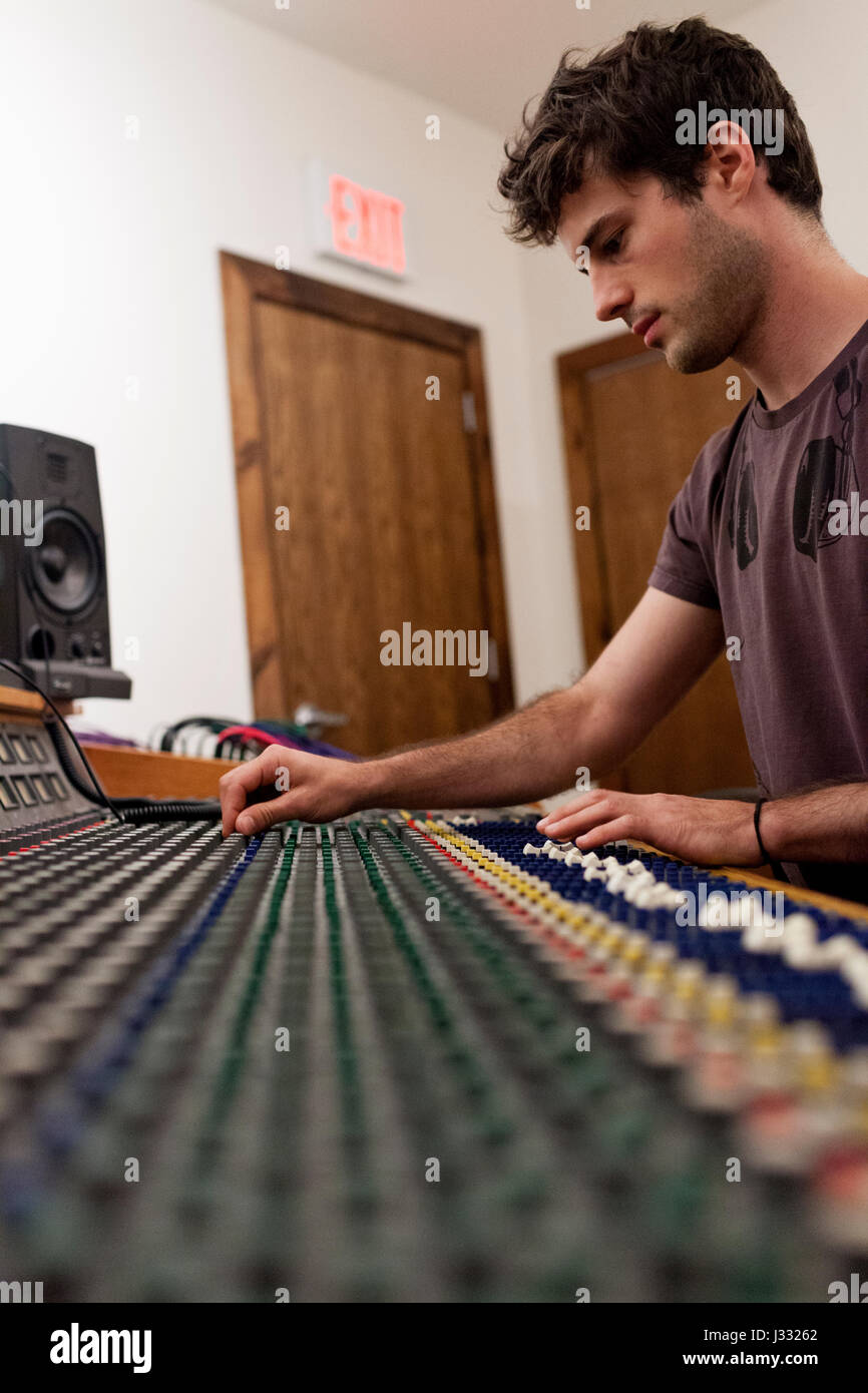 Audio engineer working at an instrument panel Stock Photo - Alamy