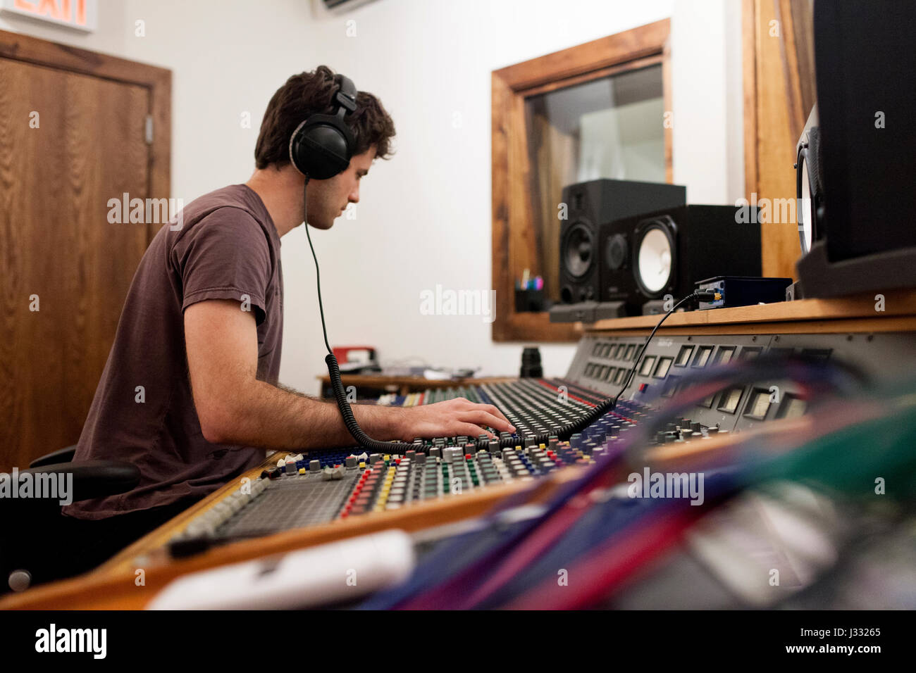 Audio engineer working at an instrument panel Stock Photo - Alamy