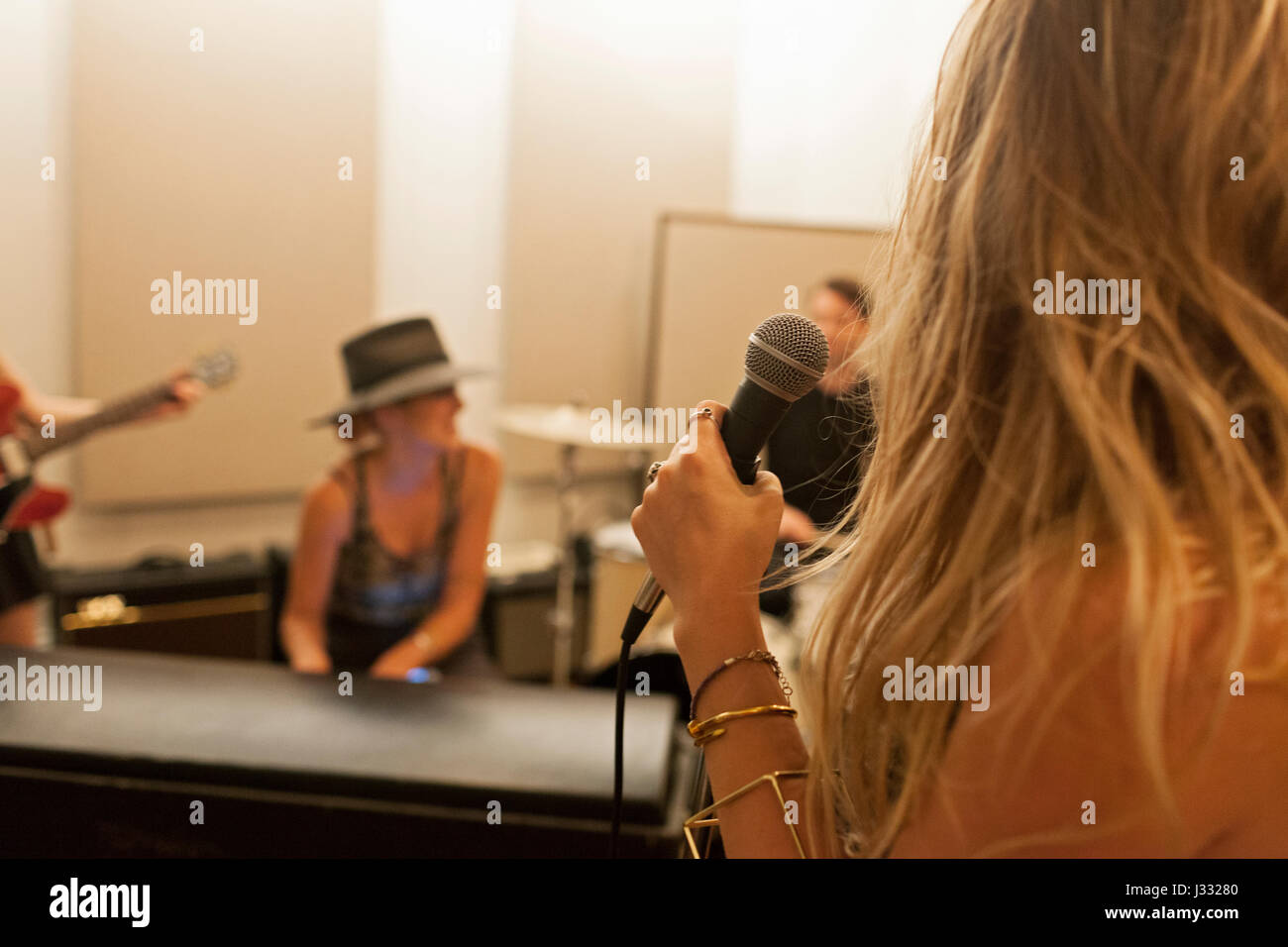 Young musicians practicing at a rehearsal space Stock Photo - Alamy