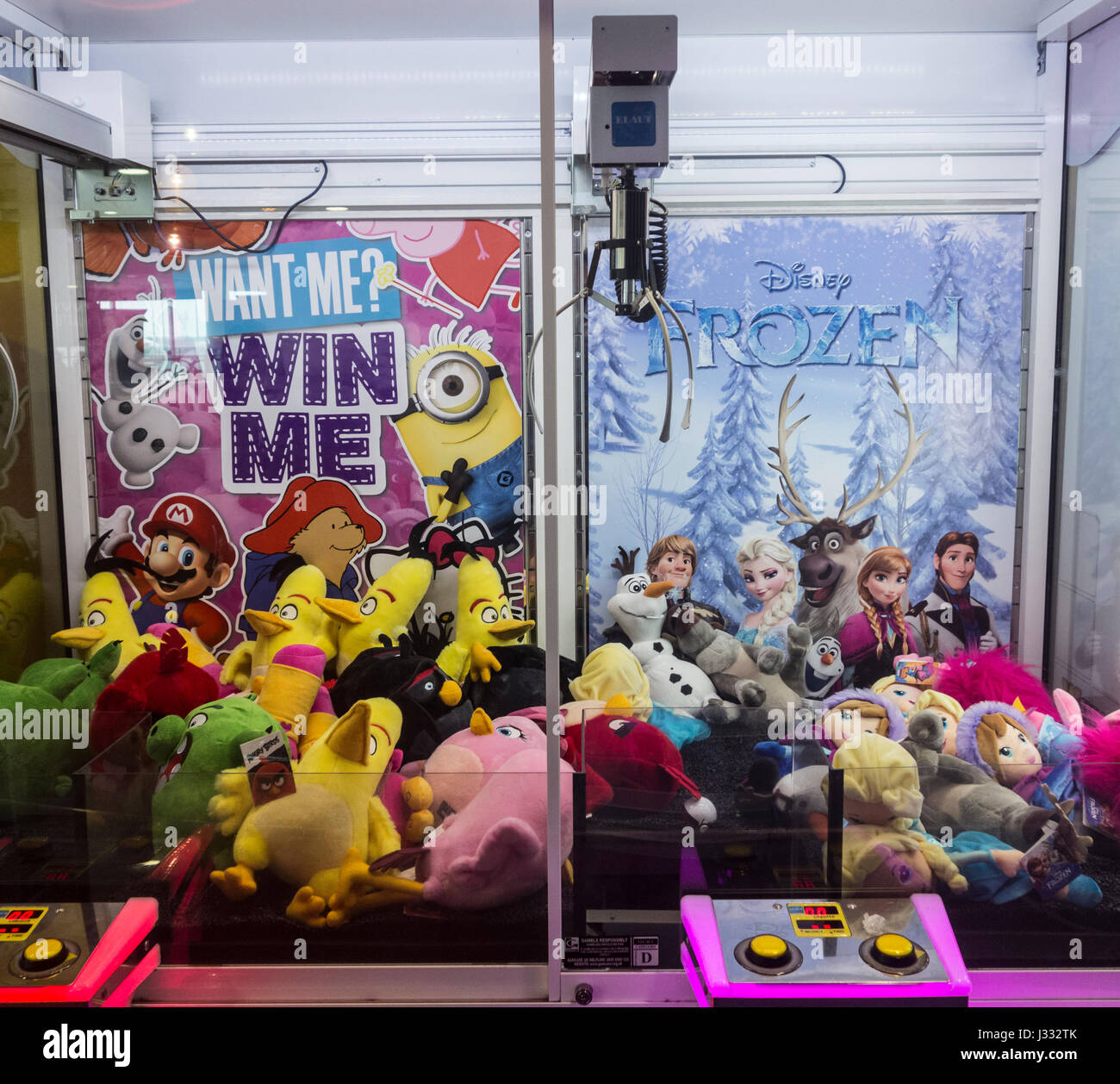 Crane grab machines in at funfair Stock Photo - Alamy