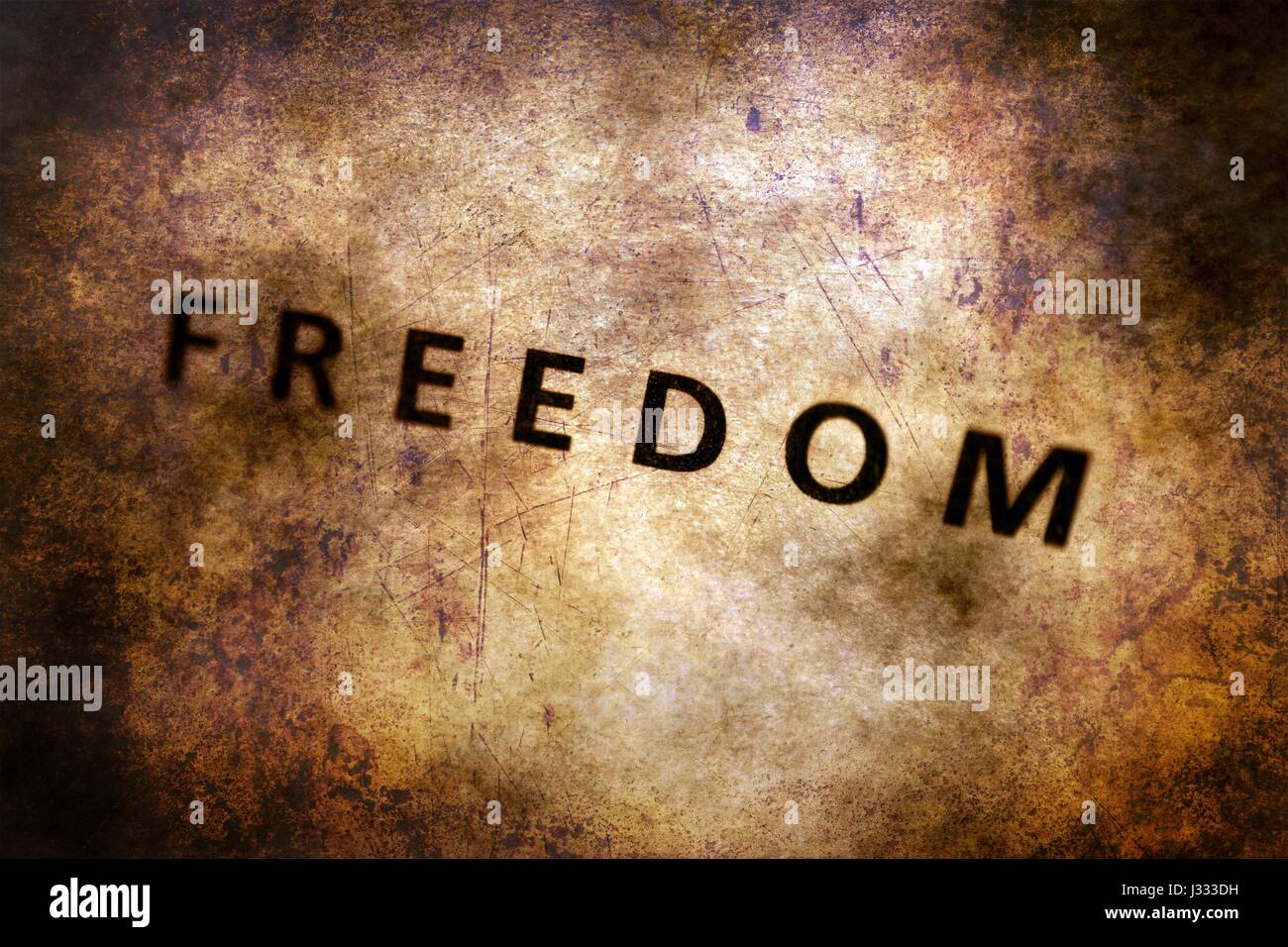 Freedom text on grunge background Stock Photo - Alamy