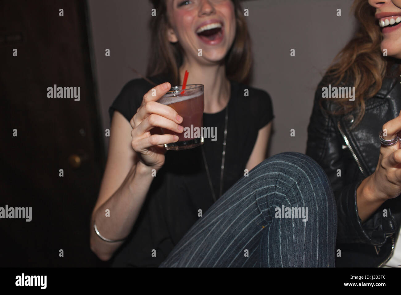 Friends hanging out at a nightclub Stock Photo - Alamy