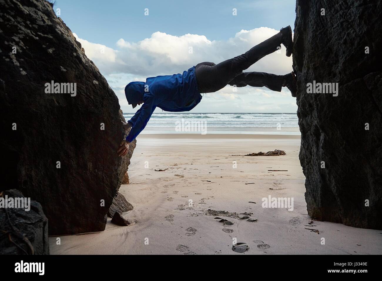 Climbing on rocks Stock Photo - Alamy