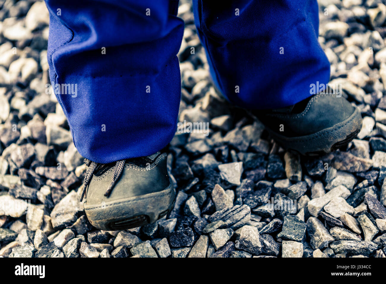 detail of child legs in overalls - boy in blue workwear Stock Photo - Alamy