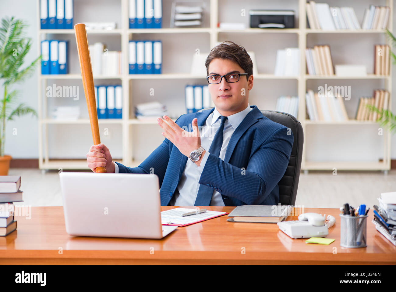 Angry aggressive businessman in the office Stock Photo - Alamy
