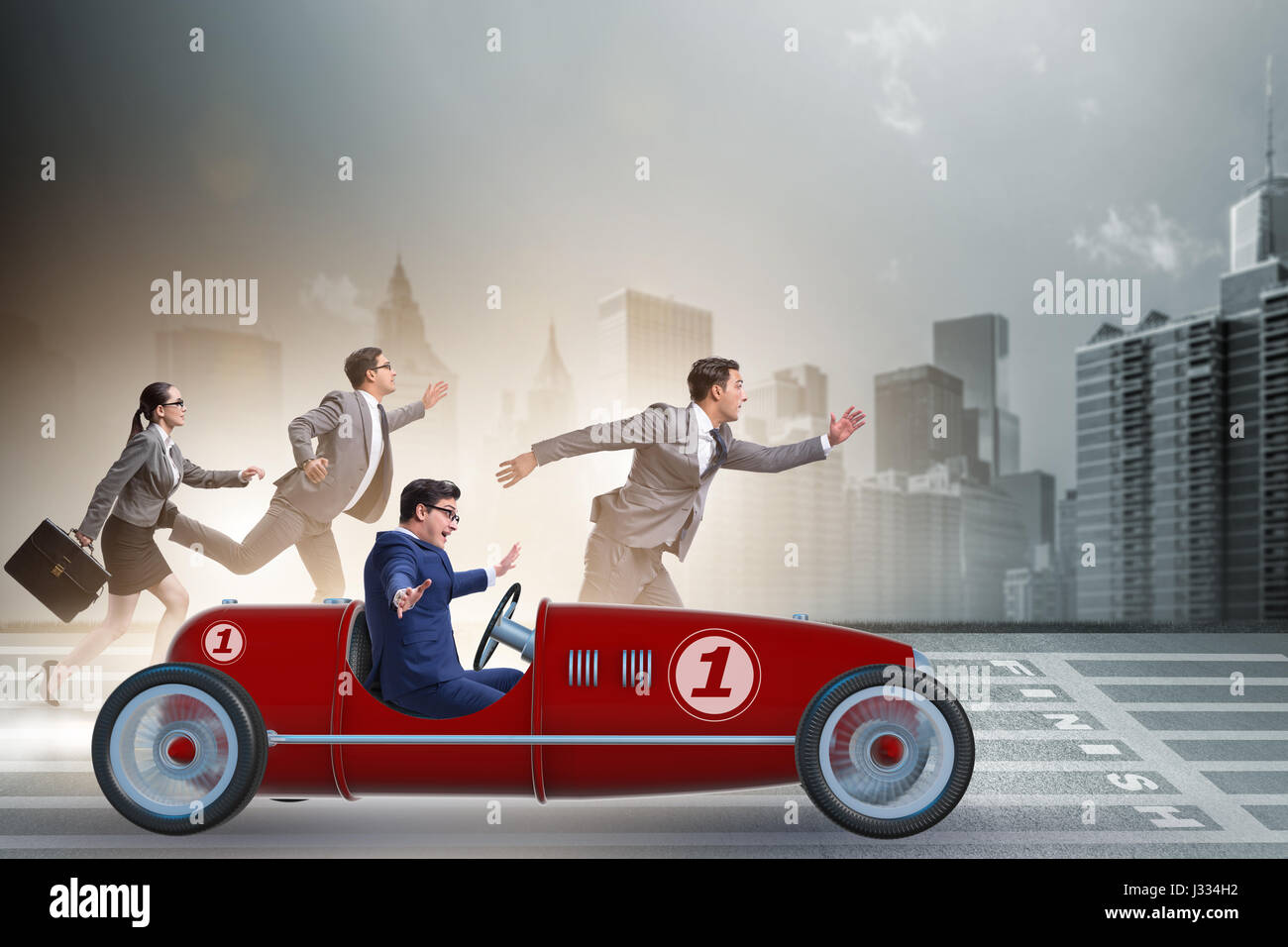 Businessman driving car in competition concept Stock Photo - Alamy