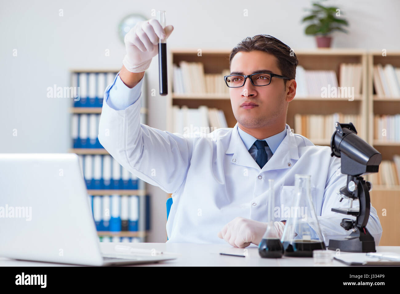 Chemical engineer working on oil samples in lab Stock Photo - Alamy
