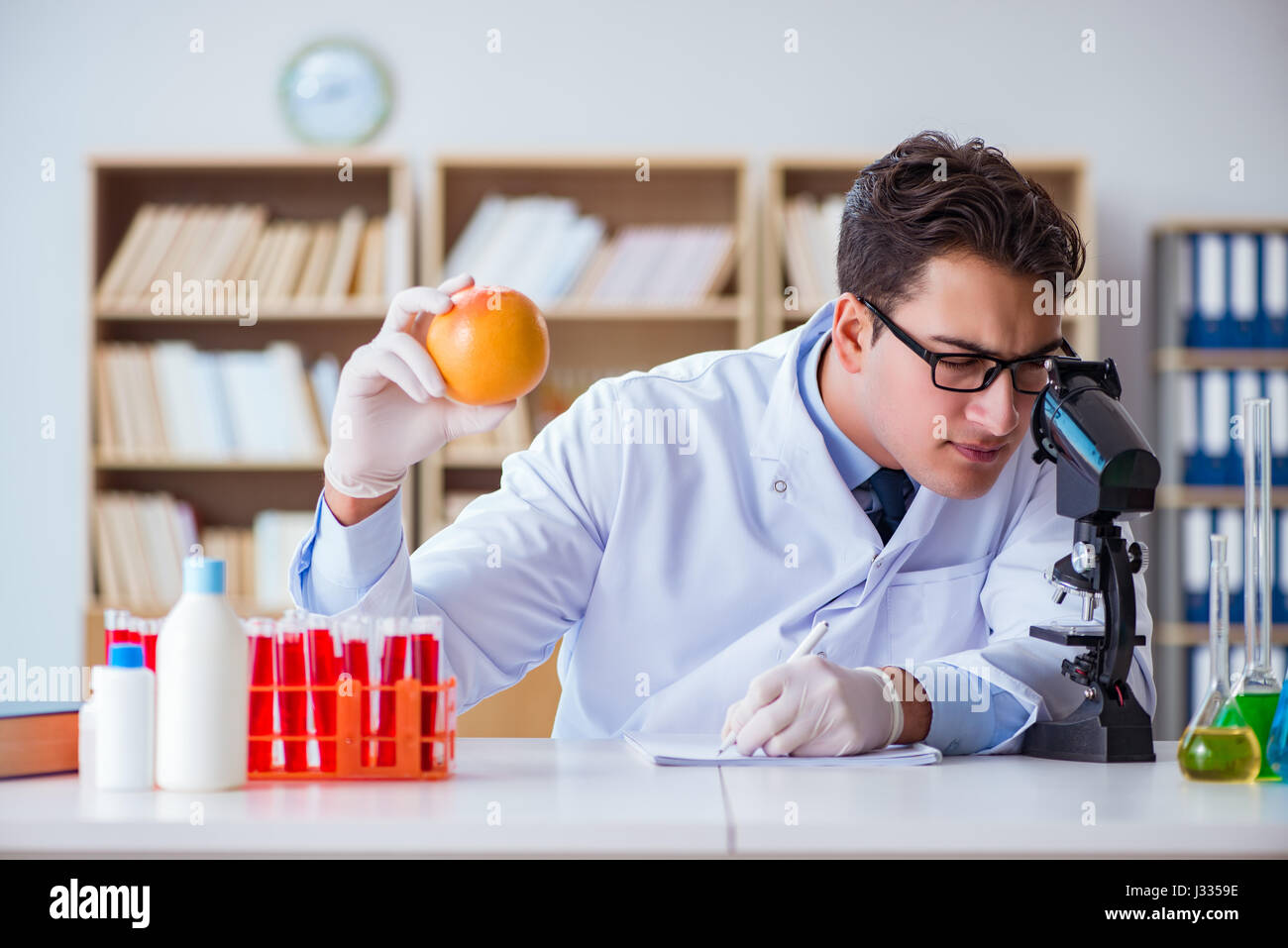 Scientist working on organic fruits and vegetables Stock Photo - Alamy