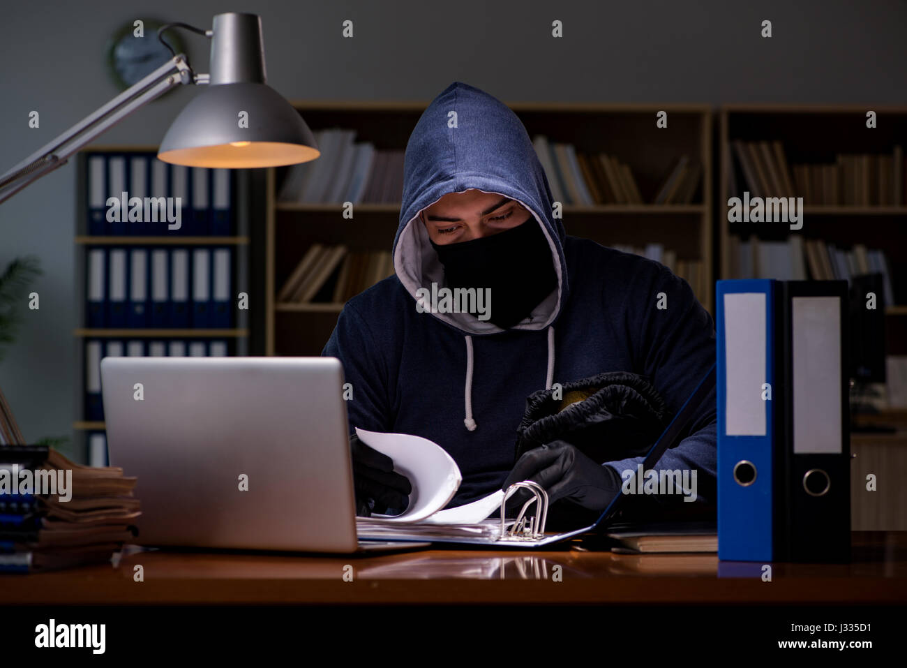 Hacker stealing personal data from home computer Stock Photo - Alamy