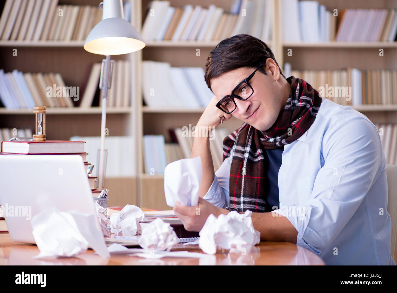Young writer working in the library Stock Photo - Alamy