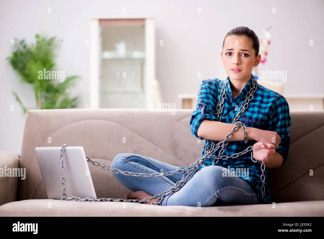 Young girl addicted to tv wasting her time Stock Photo - Alamy