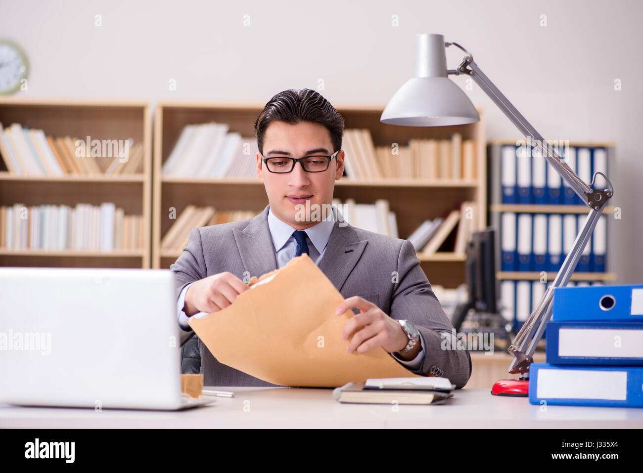 Businessman receiving letter in the office Stock Photo - Alamy