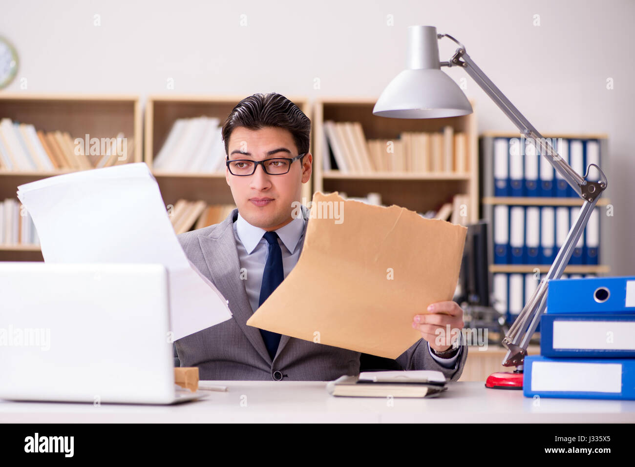 Businessman receiving letter in the office Stock Photo - Alamy