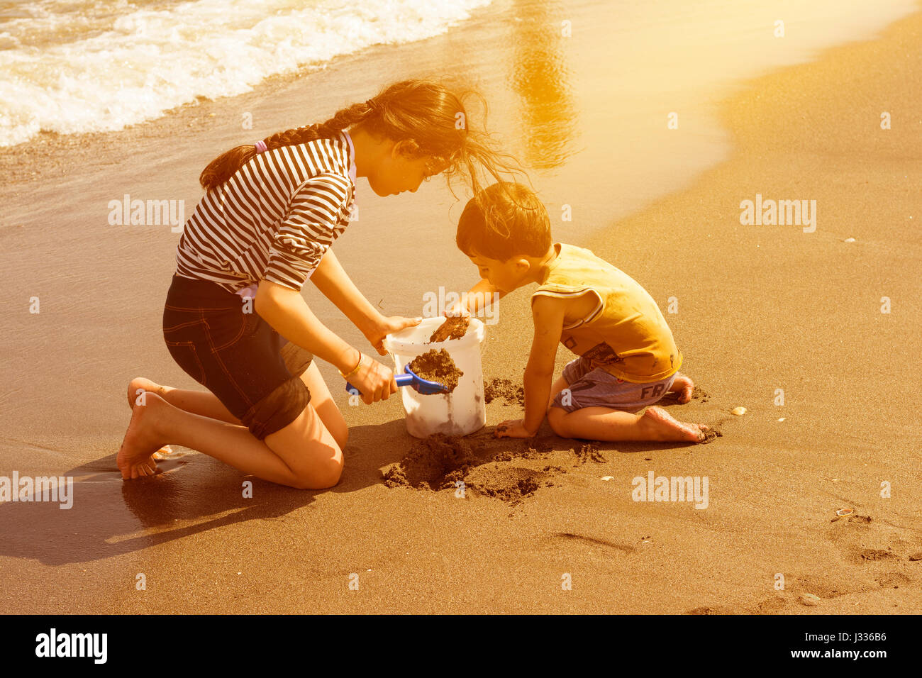 Brother and sister working together hi-res stock photography and images ...