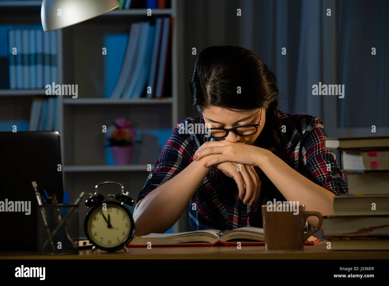 Frustrated college female student studying poorly at late evening night ...