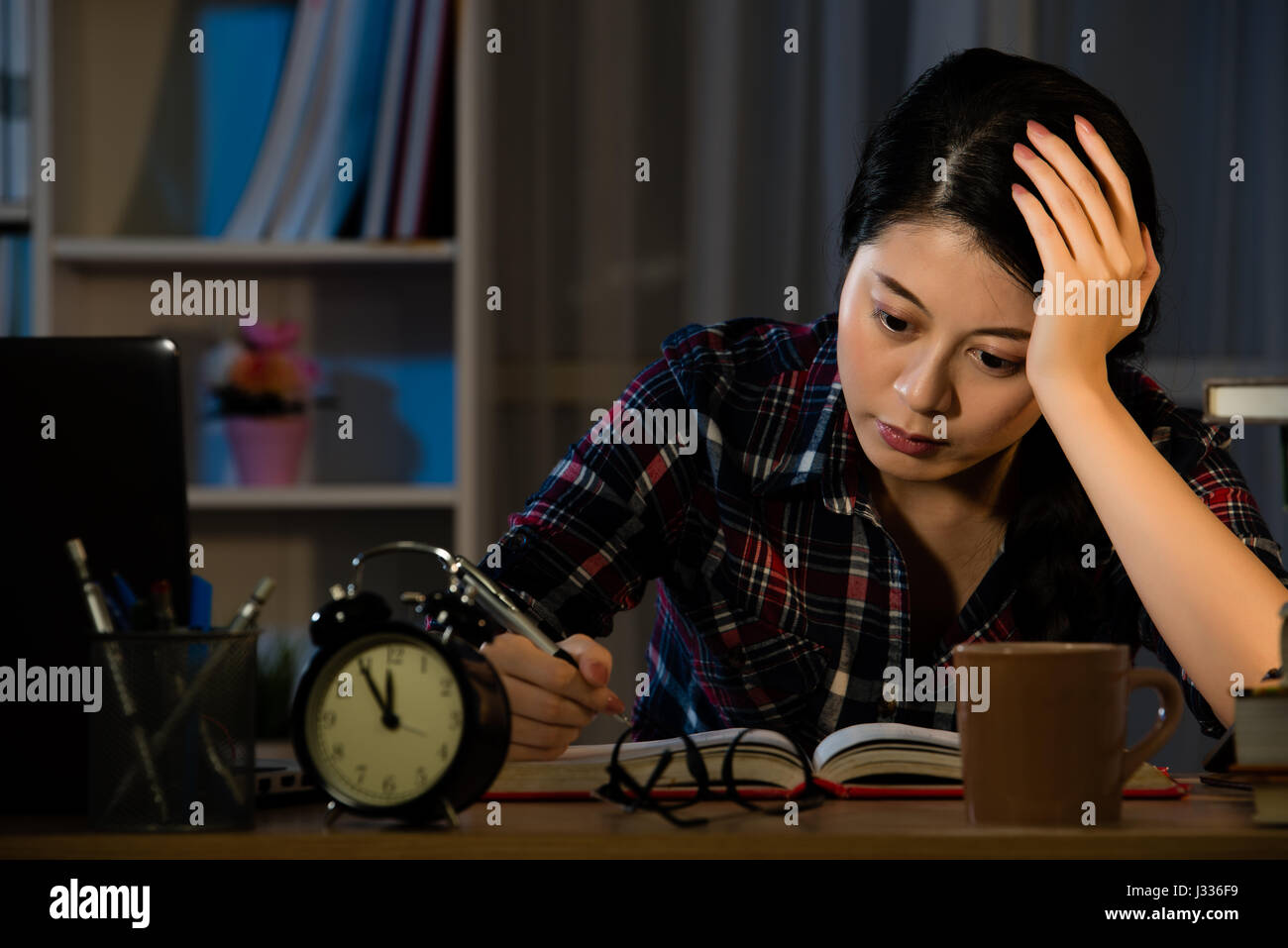 Efficient student girl late at night at home, education and school ...