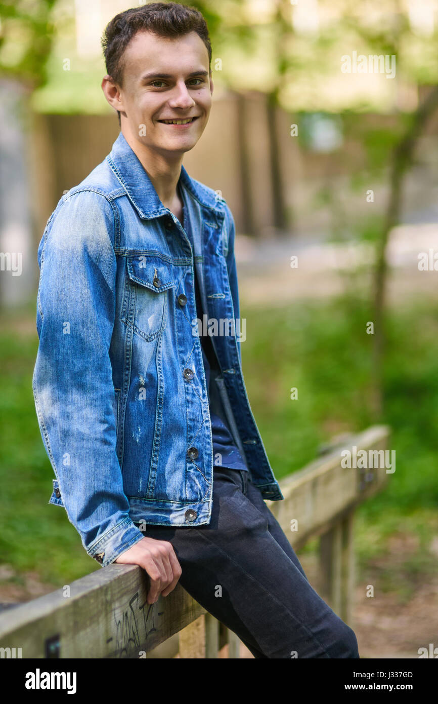 Handsome teenage boy portrait in the forest park Stock Photo - Alamy