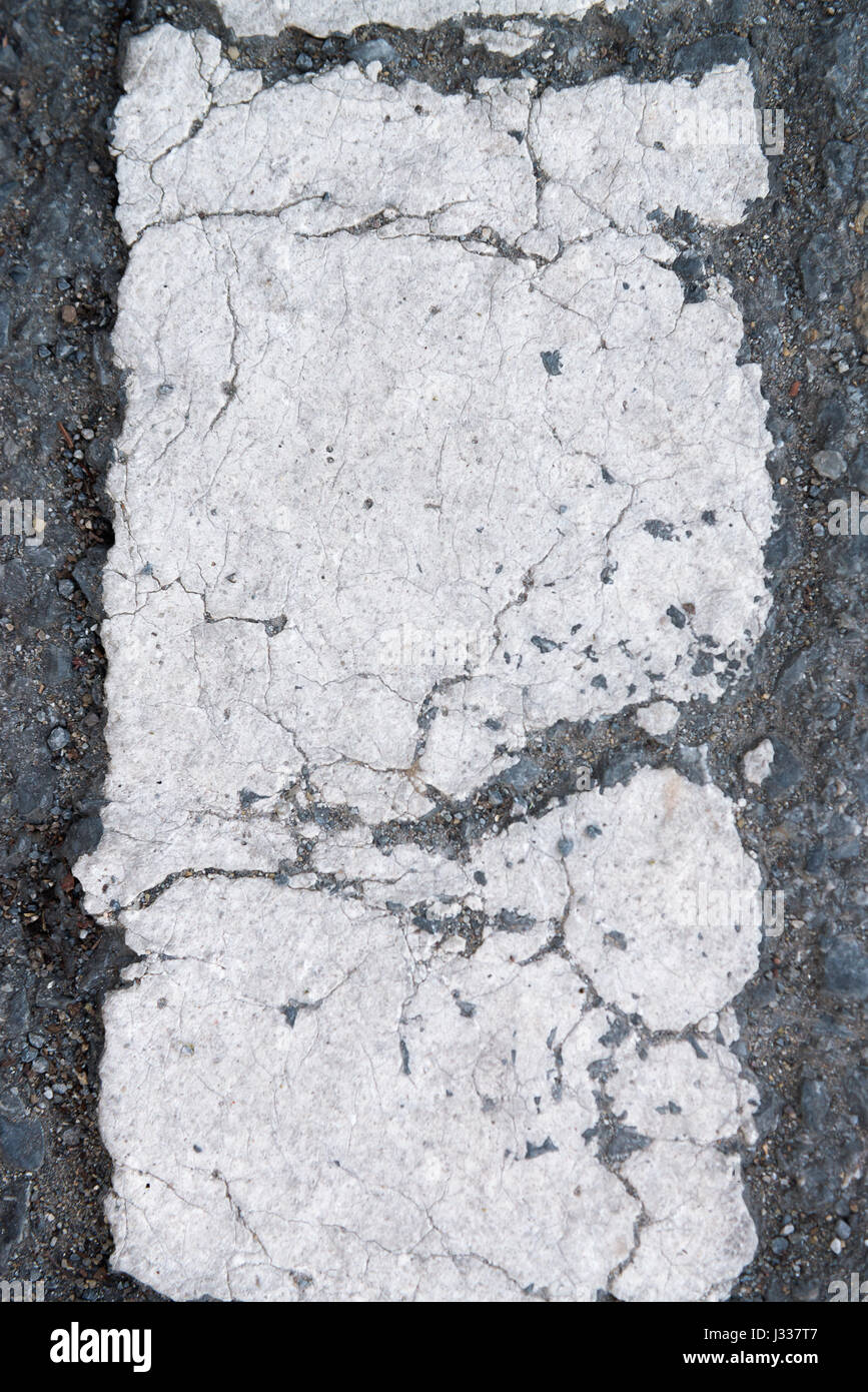 Detail of old white line on the road texture Stock Photo - Alamy