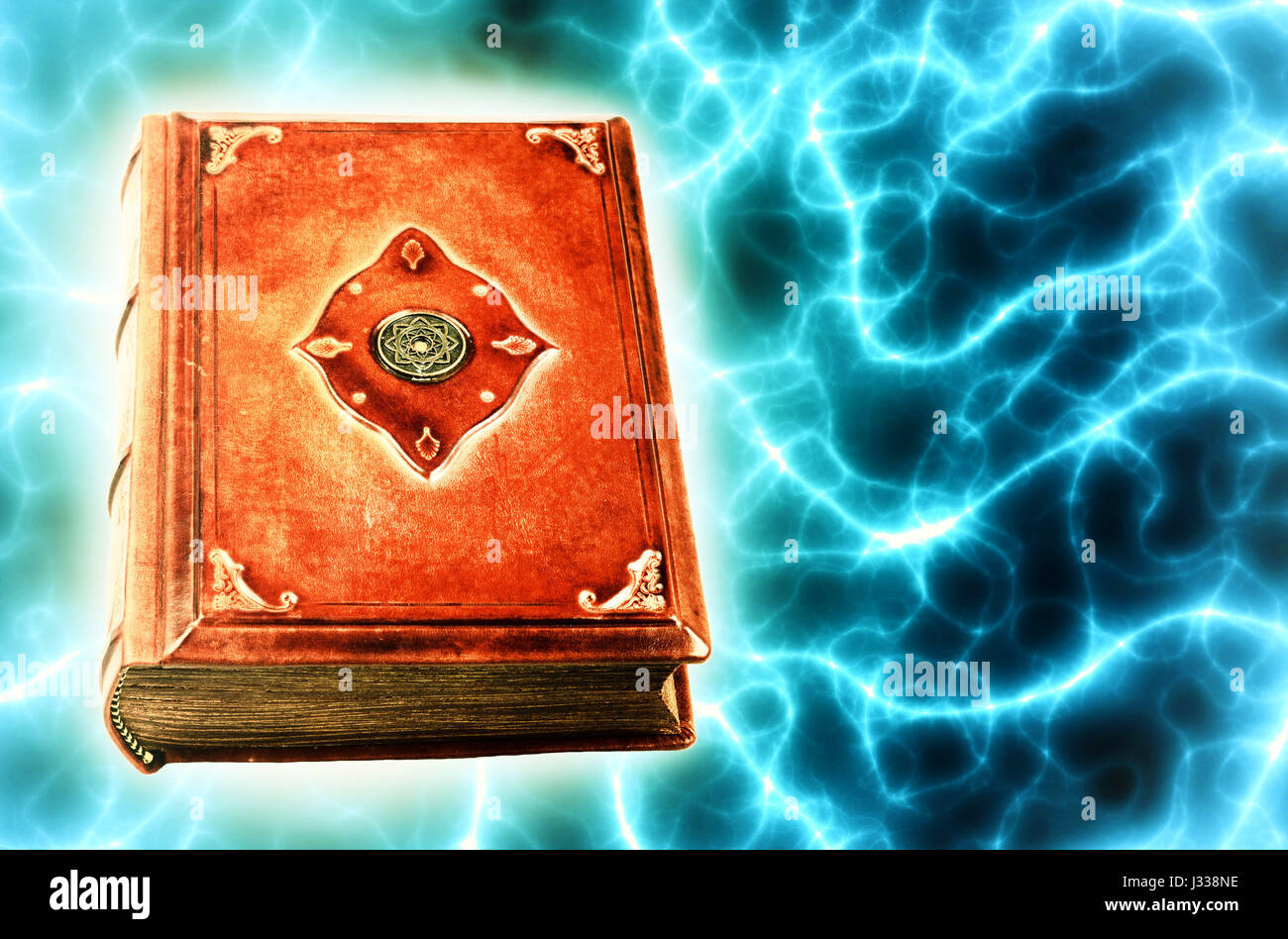 leather covered magic book with energy light around it Stock Photo - Alamy