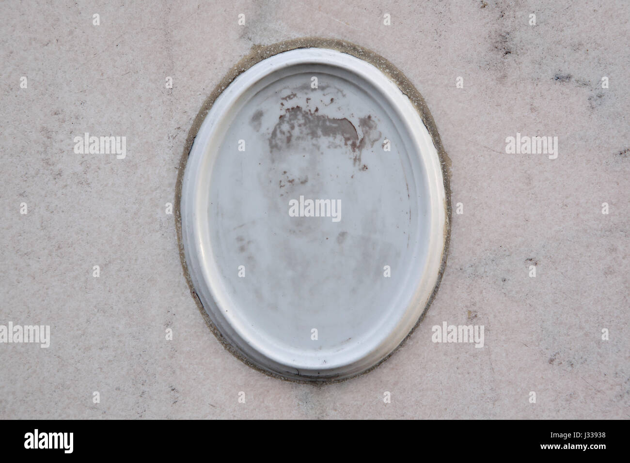 Badly damaged photograph on the tombstone of Soviet military officer ...