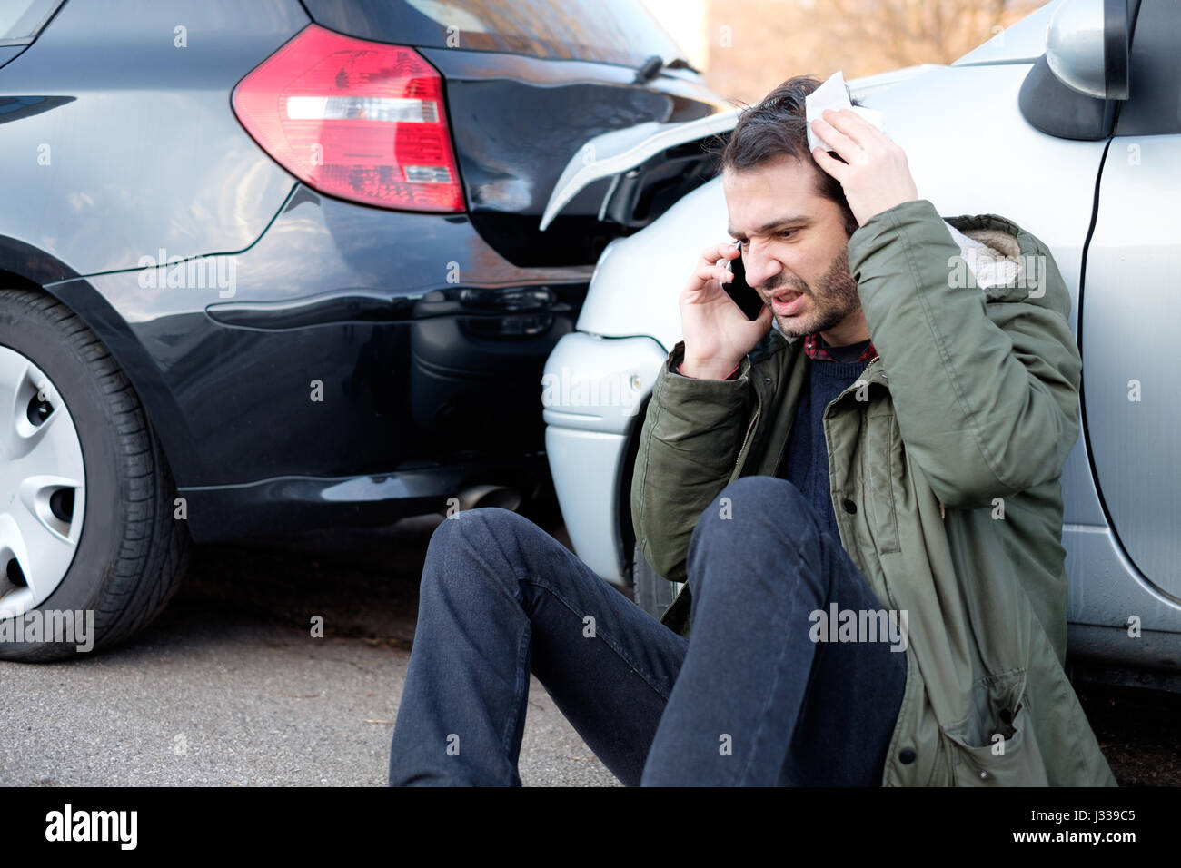 Man calling first aid after car crash accident Stock Photo - Alamy