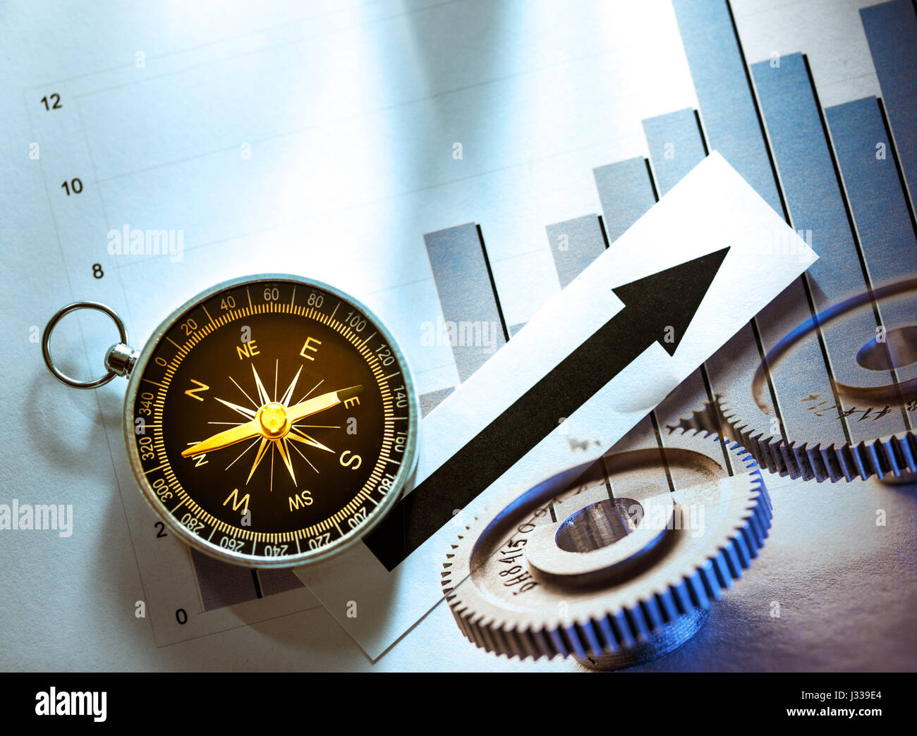 Diagram concept with compass and arrow in light Stock Photo - Alamy