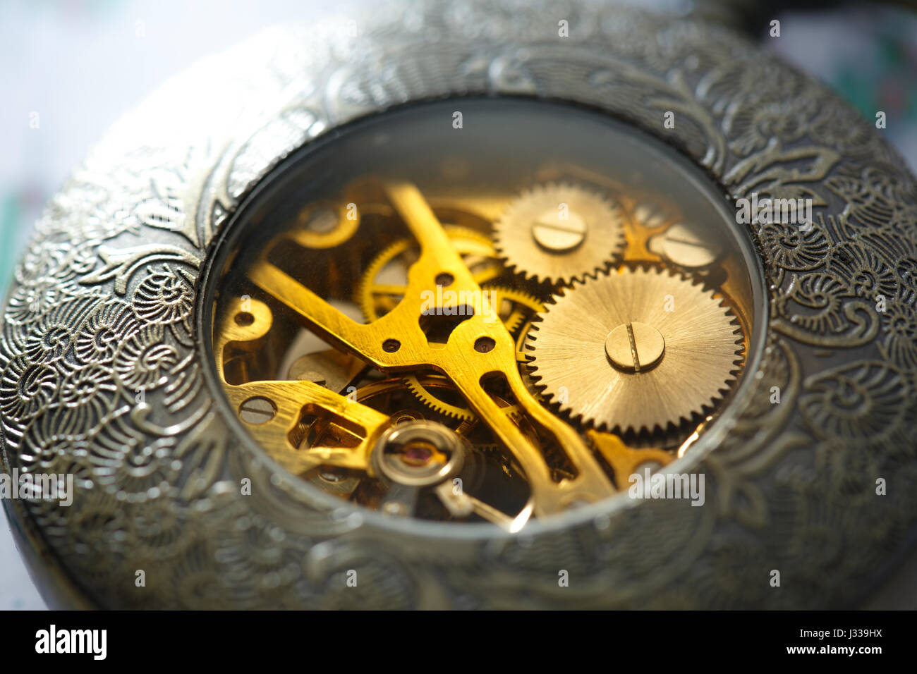 Metal inside mechanism of pocket watch in closeup Stock Photo - Alamy