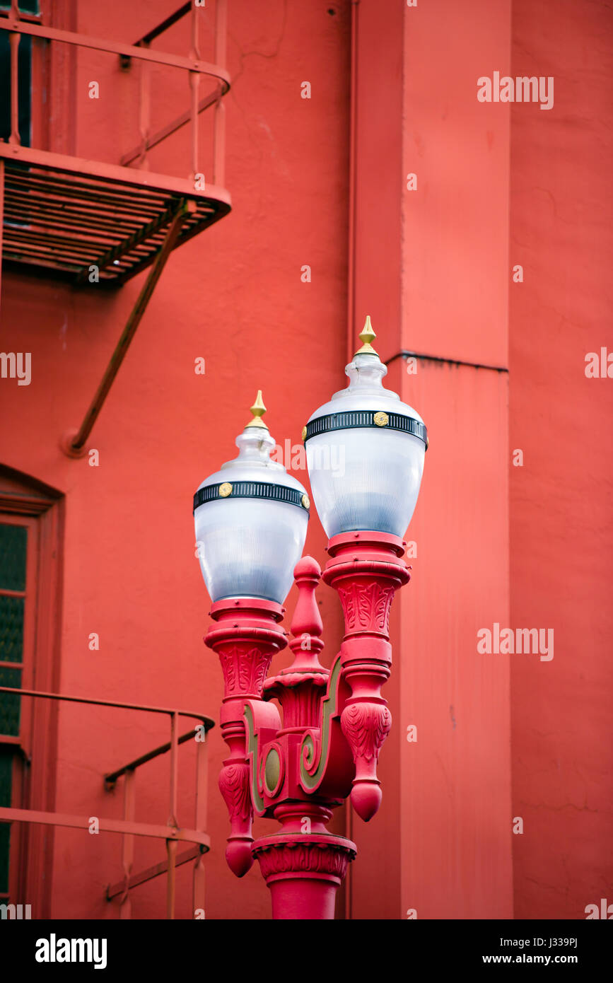 Classic elegant red lamppost with two frosted translucent fluted bowl ...