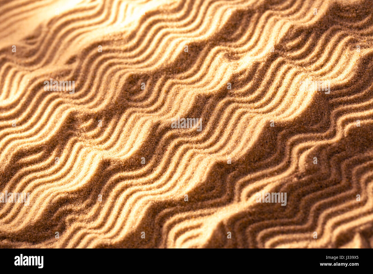 Waves of sand as nature background closeup Stock Photo - Alamy